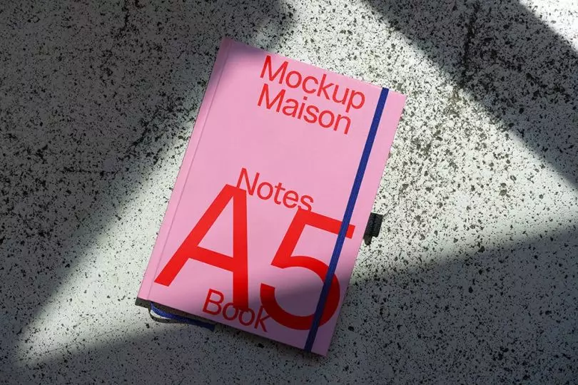 Mockup Buku BK E12 melalui [Mockup Maison](https://www.mockup.maison/)