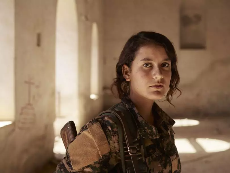 Perwîn, a volunteer YJÊ fighter, inside an abandoned Christian church. Shengal, Nineveh Governorate, Iraq, November 11, 2016. From [We Came From Fire ]( https://amzn.to/2L9l8Vm) by Joey L. – published by powerHouse Books